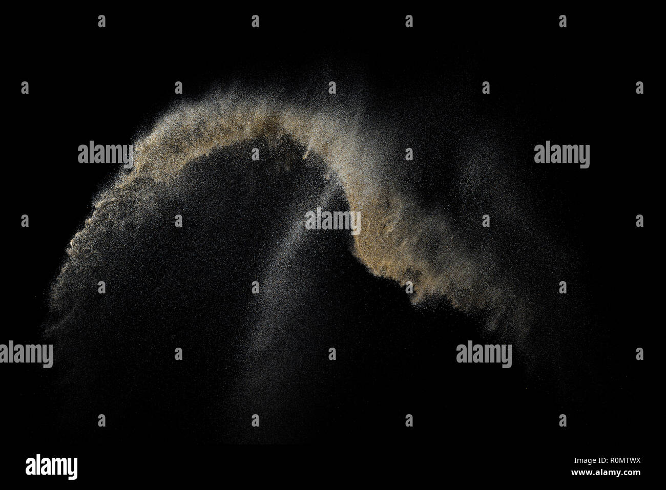 Sandy explosion isolated on black background. Abstract particles cloud ...