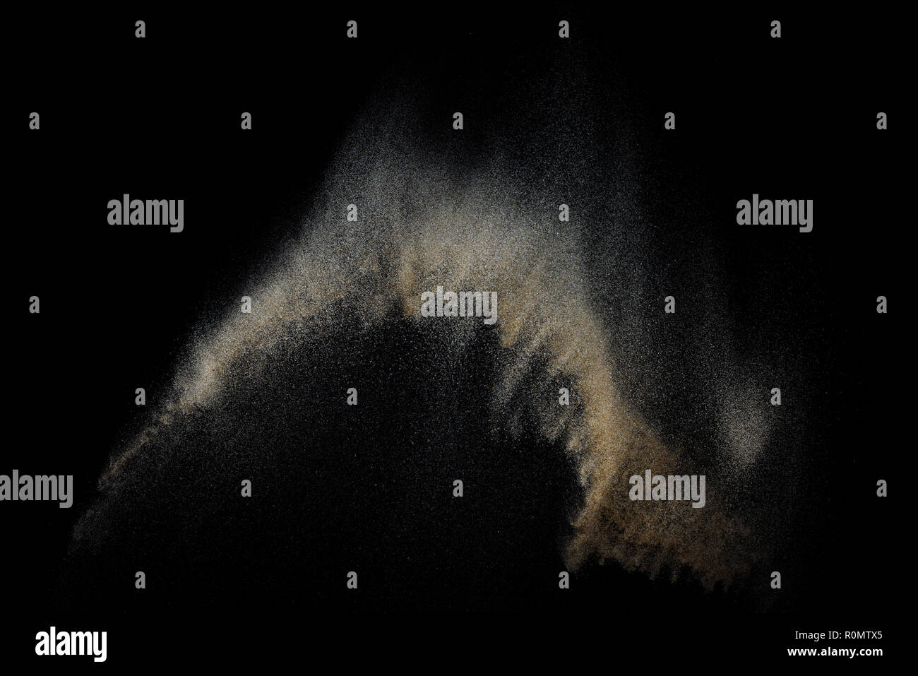 Sandy explosion isolated on black background. Abstract particles cloud ...