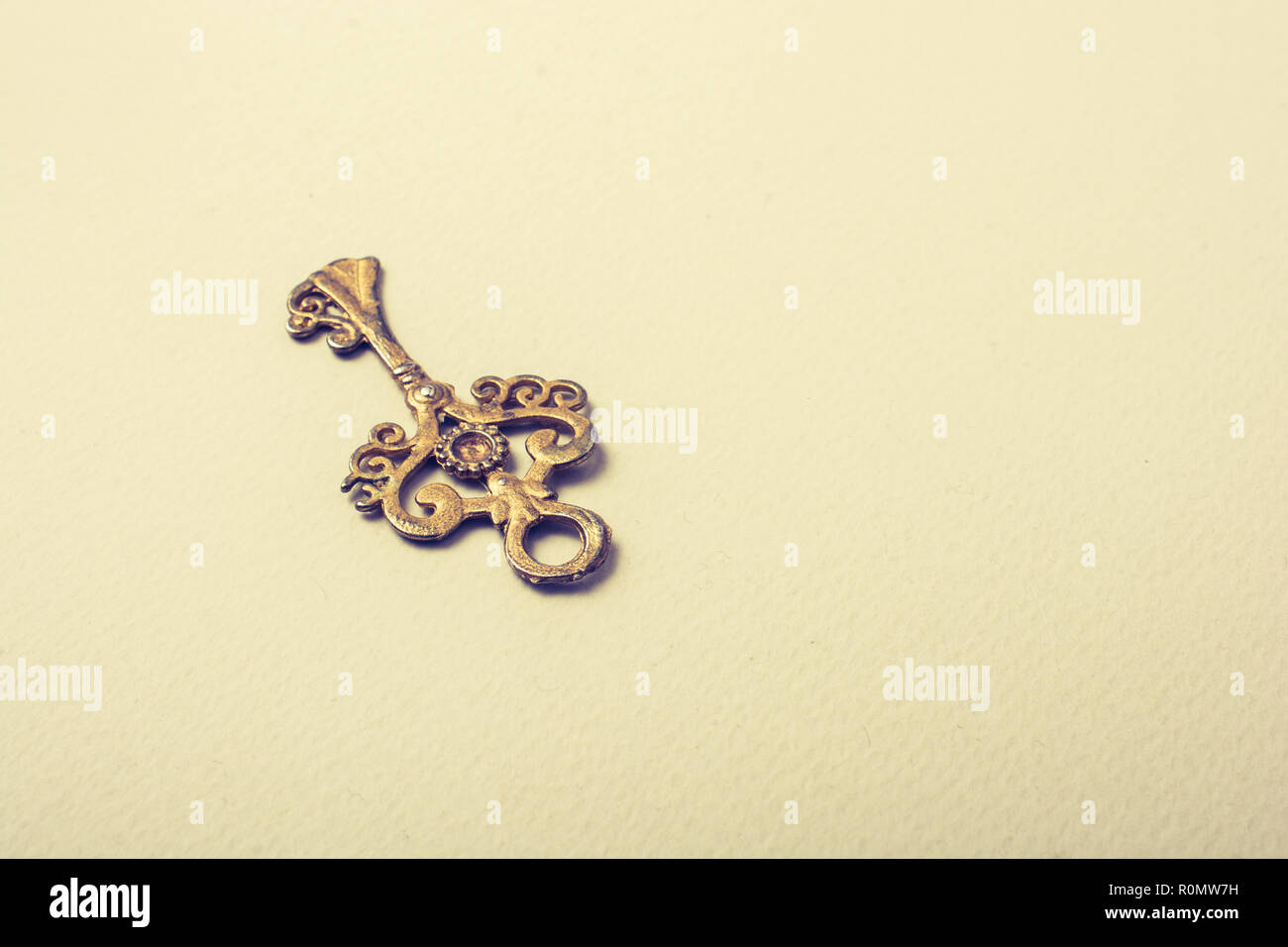 Retro style gold color key on white background Stock Photo - Alamy