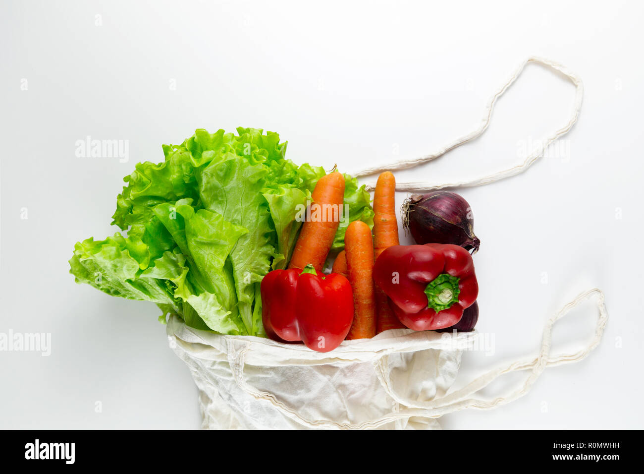 zero waste concept. Vegetables in a woven bag Stock Photo - Alamy