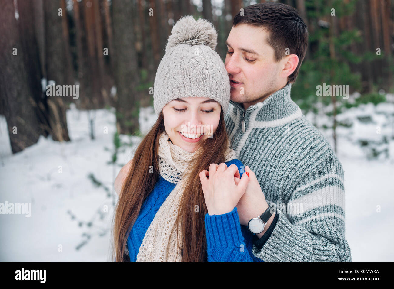 outdoor portrait of young sensual couple in cold winter wather. love ...