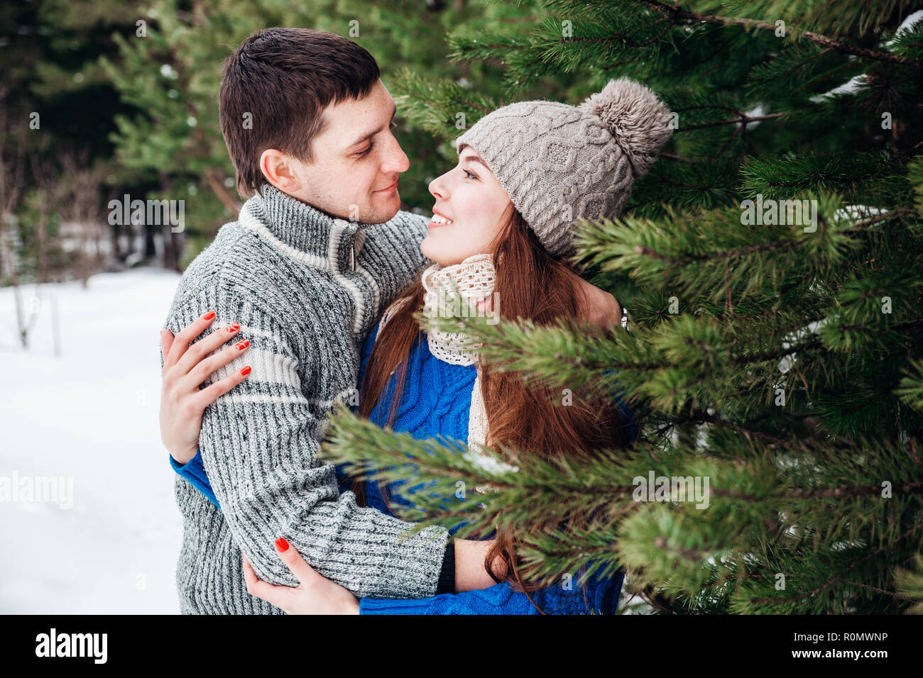 outdoor portrait of young sensual couple in cold winter wather. love ...
