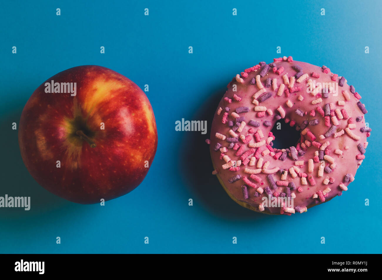 Apple and donut, concept of choice health and unhealthy diet Stock ...