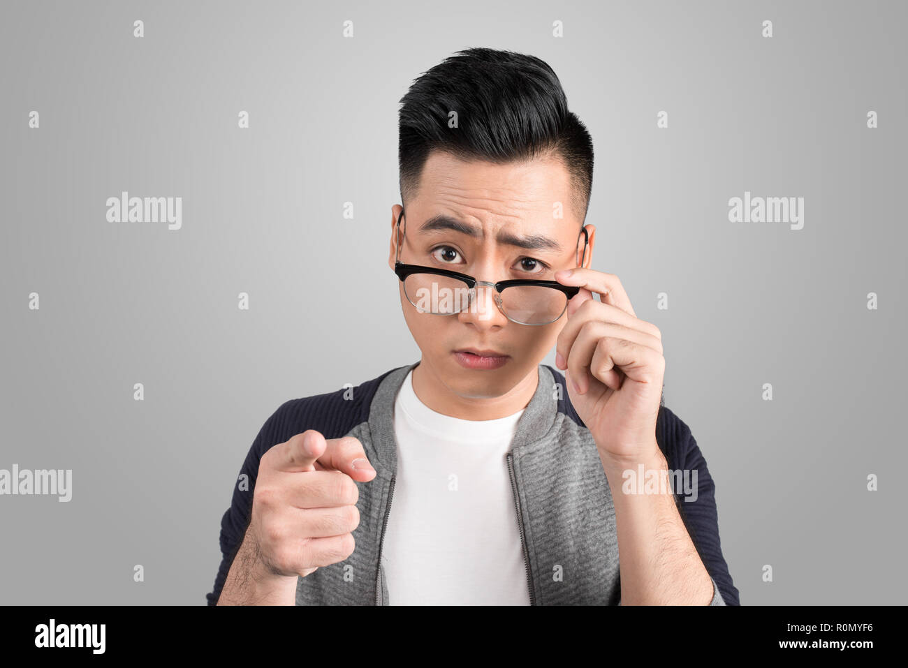 Surprised handsome man showing something Stock Photo - Alamy
