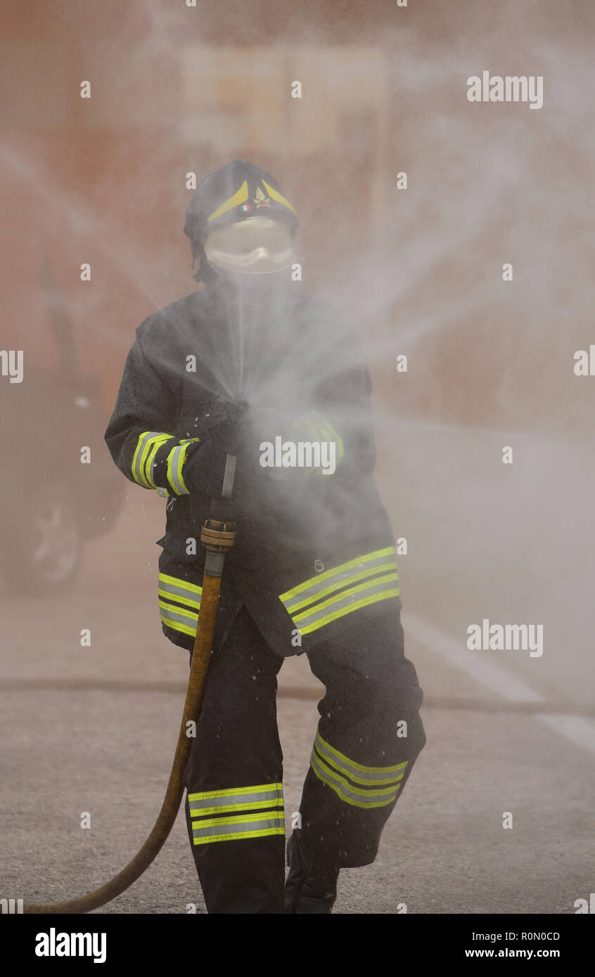 Italia, Italy - May 10, 2018: italian fireman with uniform and helmet ...