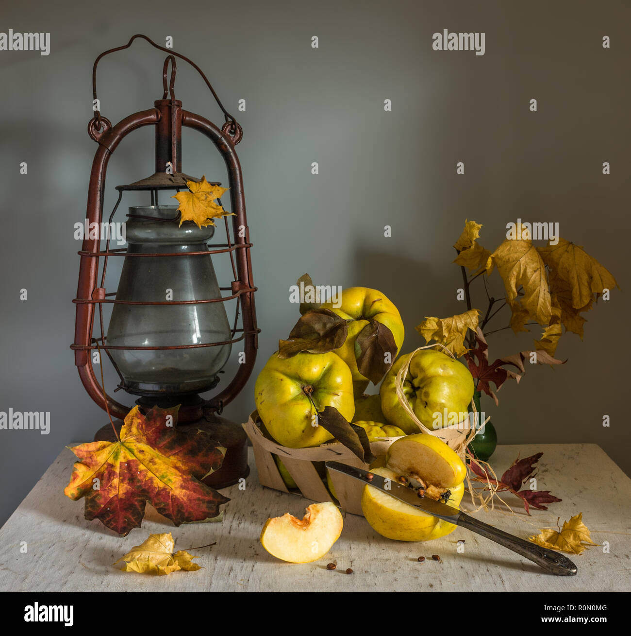 still life with quince and kerosene lamp. kitchen. vintage retro Stock ...