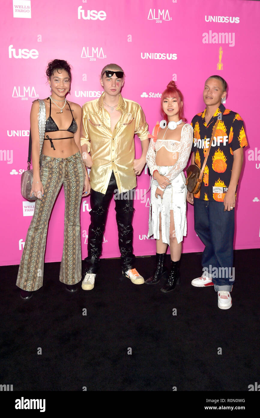 DJ Odalys, Dallas, MILK and Poster Boy attending the American Latino ...