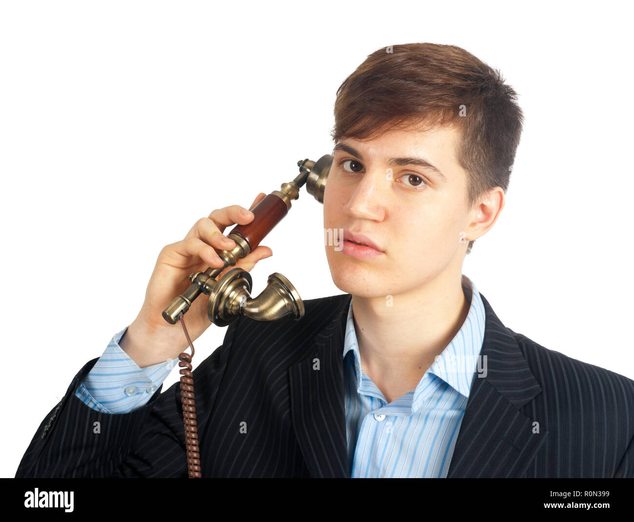 Portrait of attractive man speaking on the wired telephone Stock Photo ...