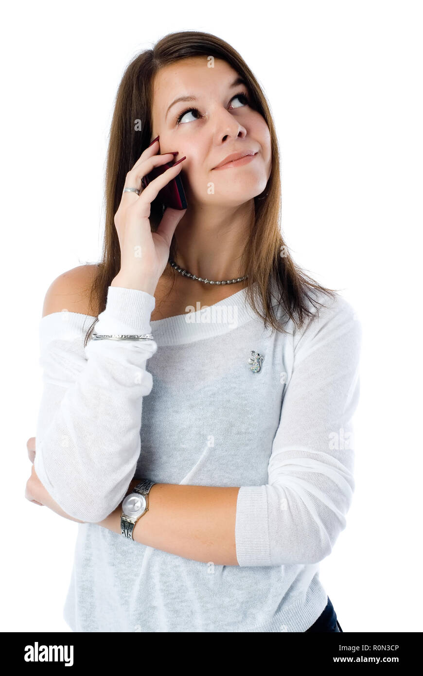 Beautiful girl talking on phone isolated over white Stock Photo - Alamy