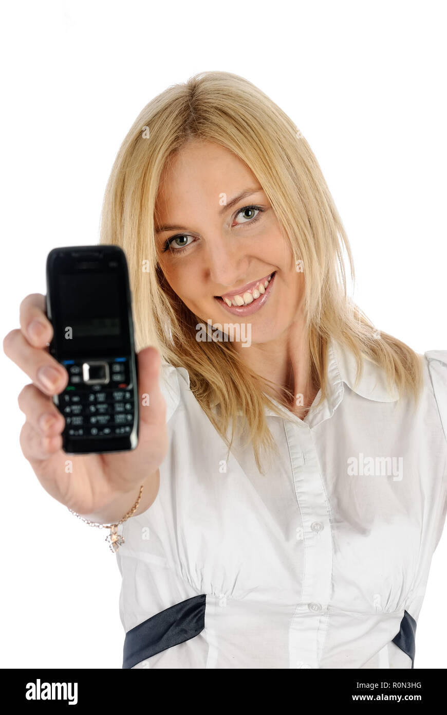 Attractive woman shows her mobile phone. Isolated over white background ...