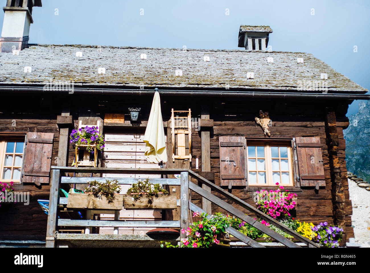 mountain house with flowers on the windows in the nature,Alpe Devero ...