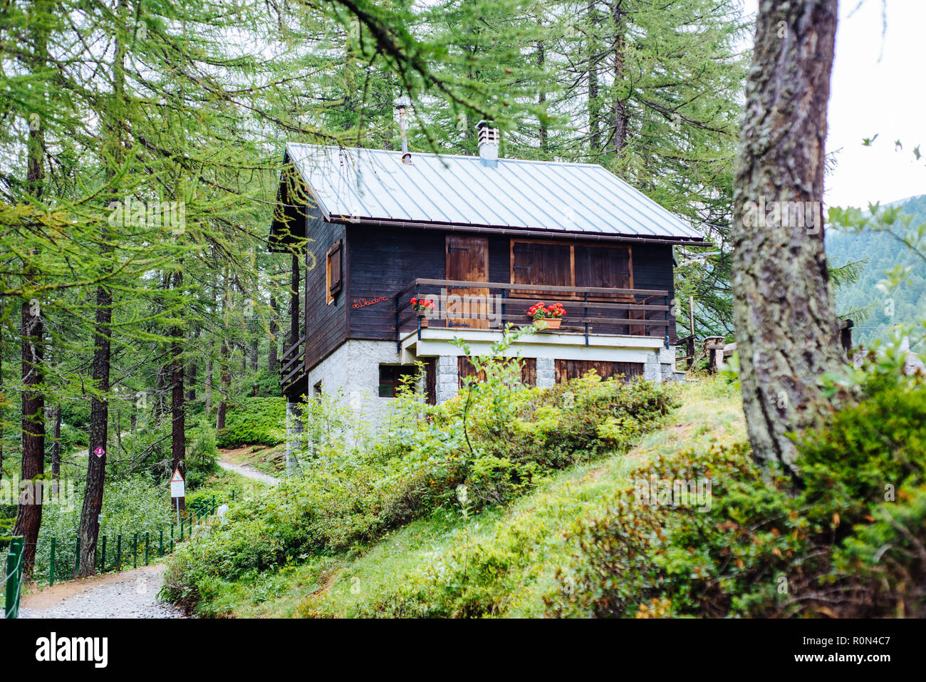 mountain house with flowers on the windows in the nature,Alpe Devero ...