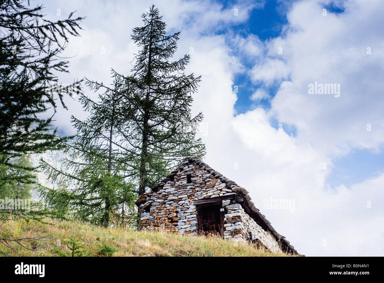 mountain house with flowers on the windows in the nature,Alpe Devero ...
