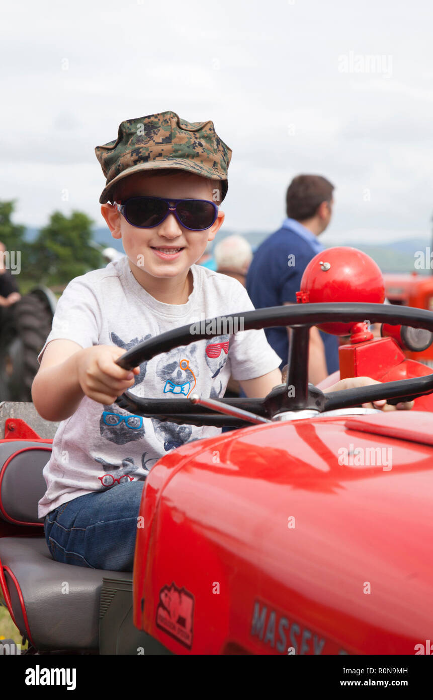 Boy and tractor hi-res stock photography and images - Alamy