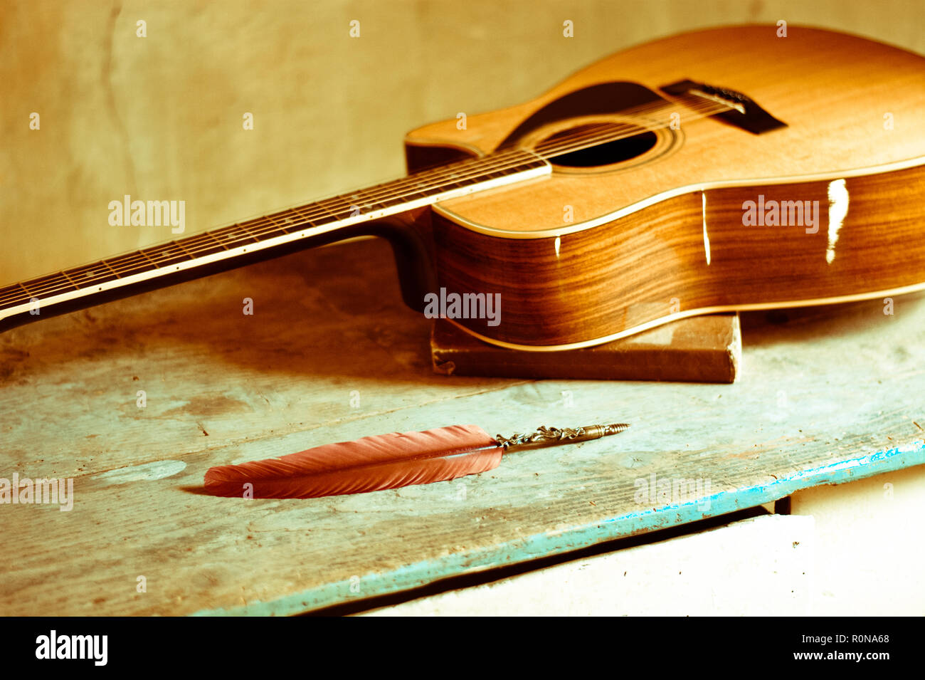 a guitar and a red pen Stock Photo - Alamy