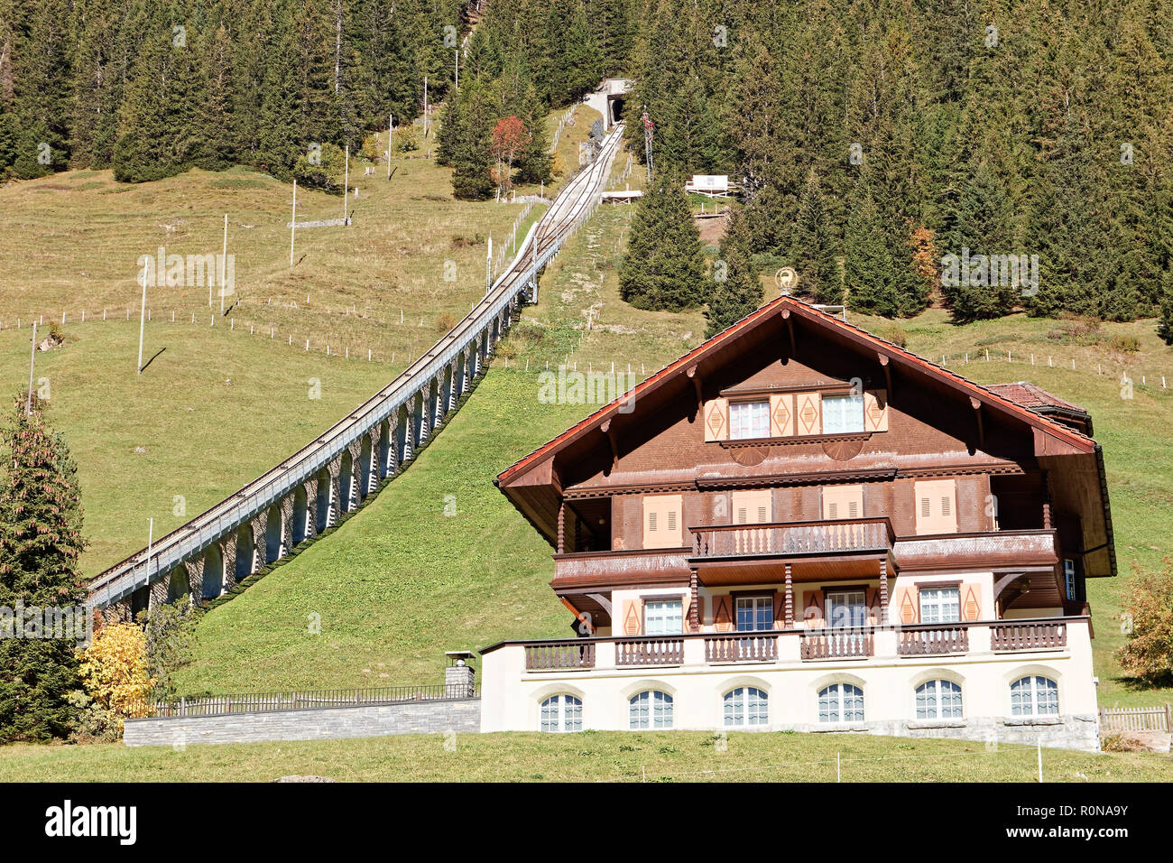 Sunny autumn day at Mürren with Allmendhubel funicular railway ...