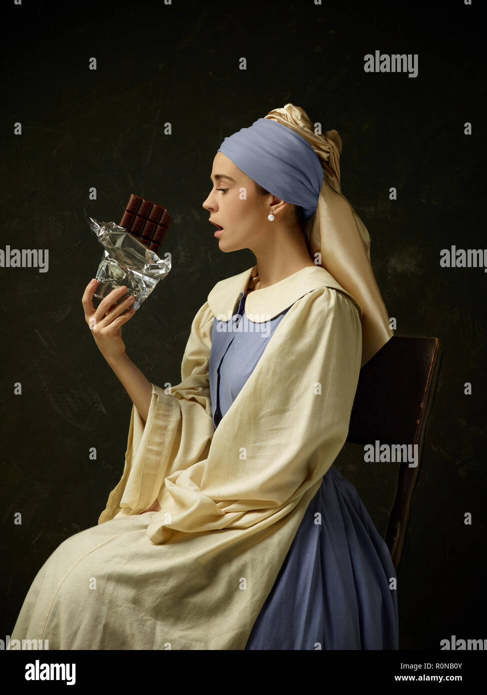 Medieval woman in historical costume wearing corset dress and bonnet ...