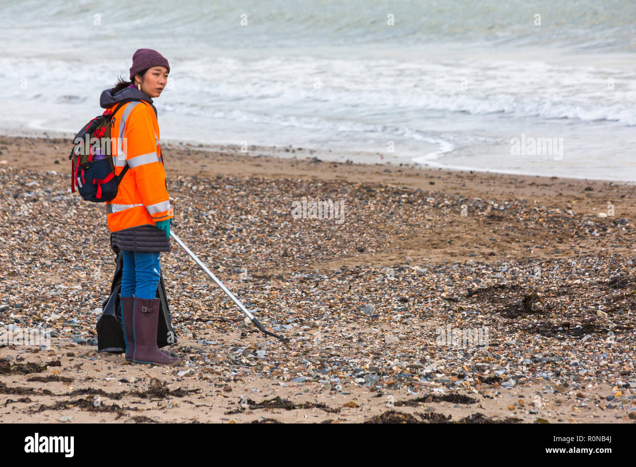 Wessex Water volunteers doing beach clean at Swanage beach, Dorset UK ...