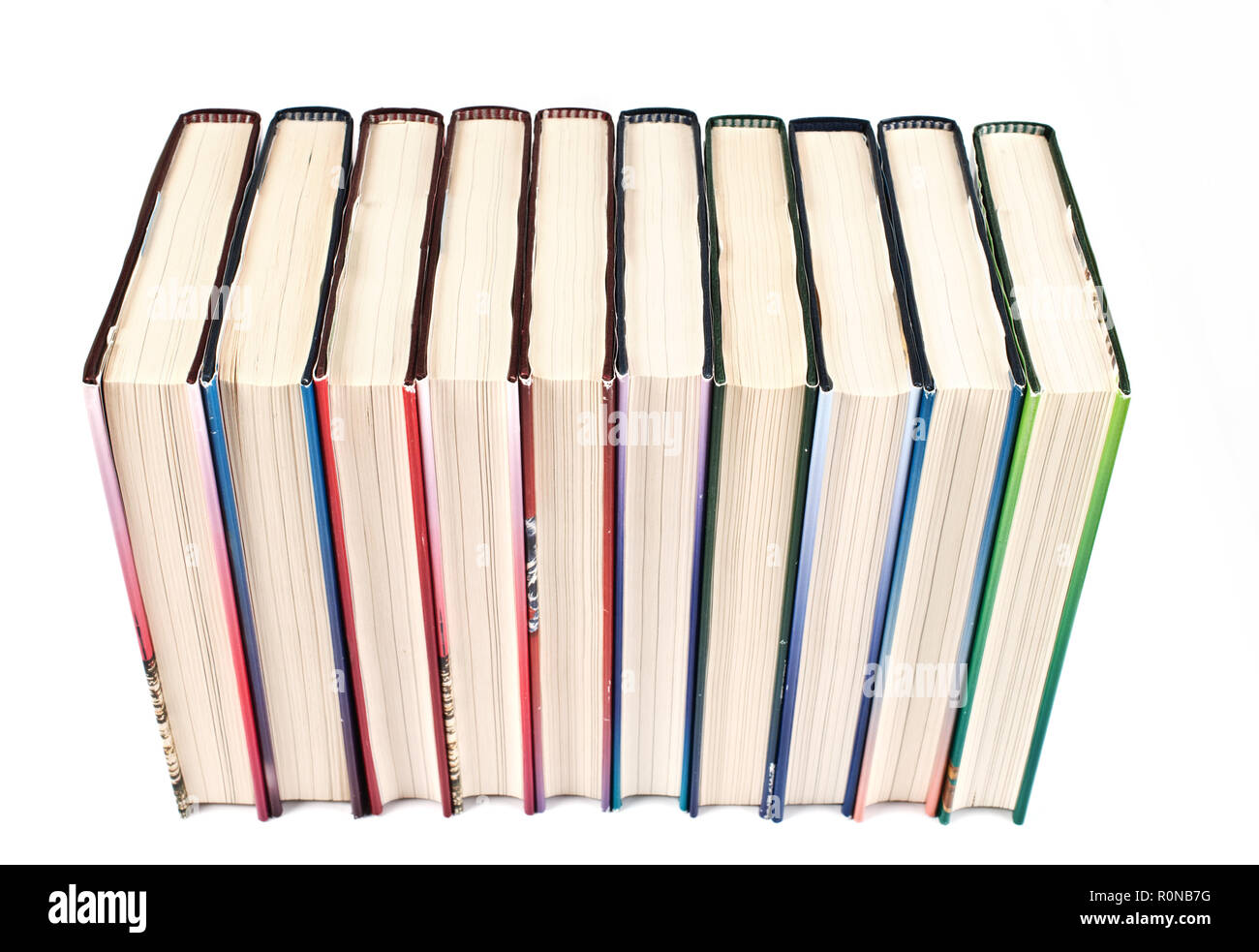 Books in a row on white background Stock Photo - Alamy