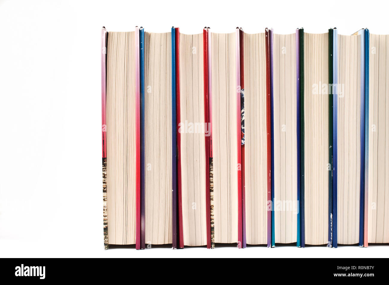 Books in a row on white background Stock Photo - Alamy