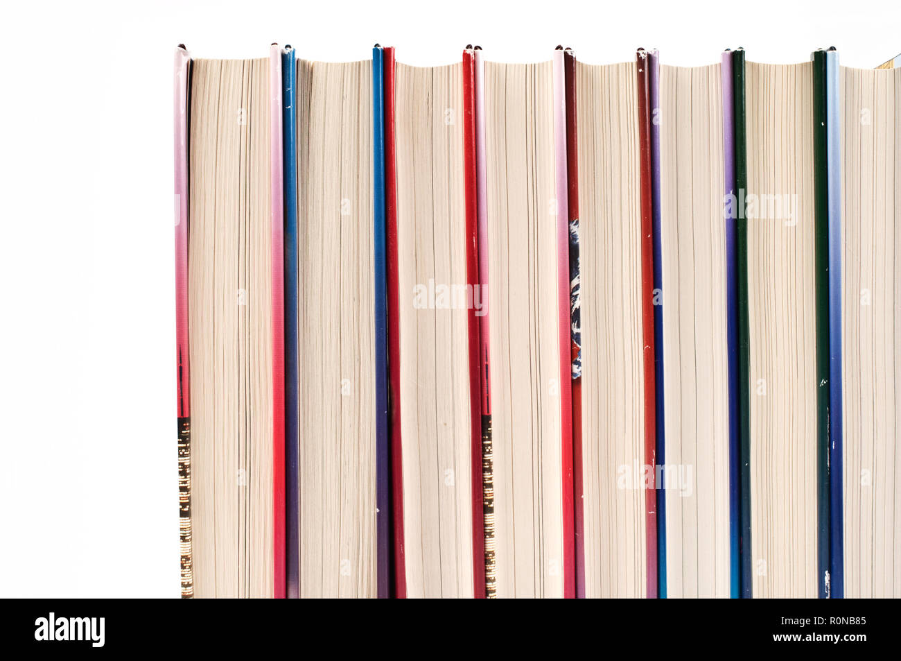 Books in a row on white background Stock Photo - Alamy
