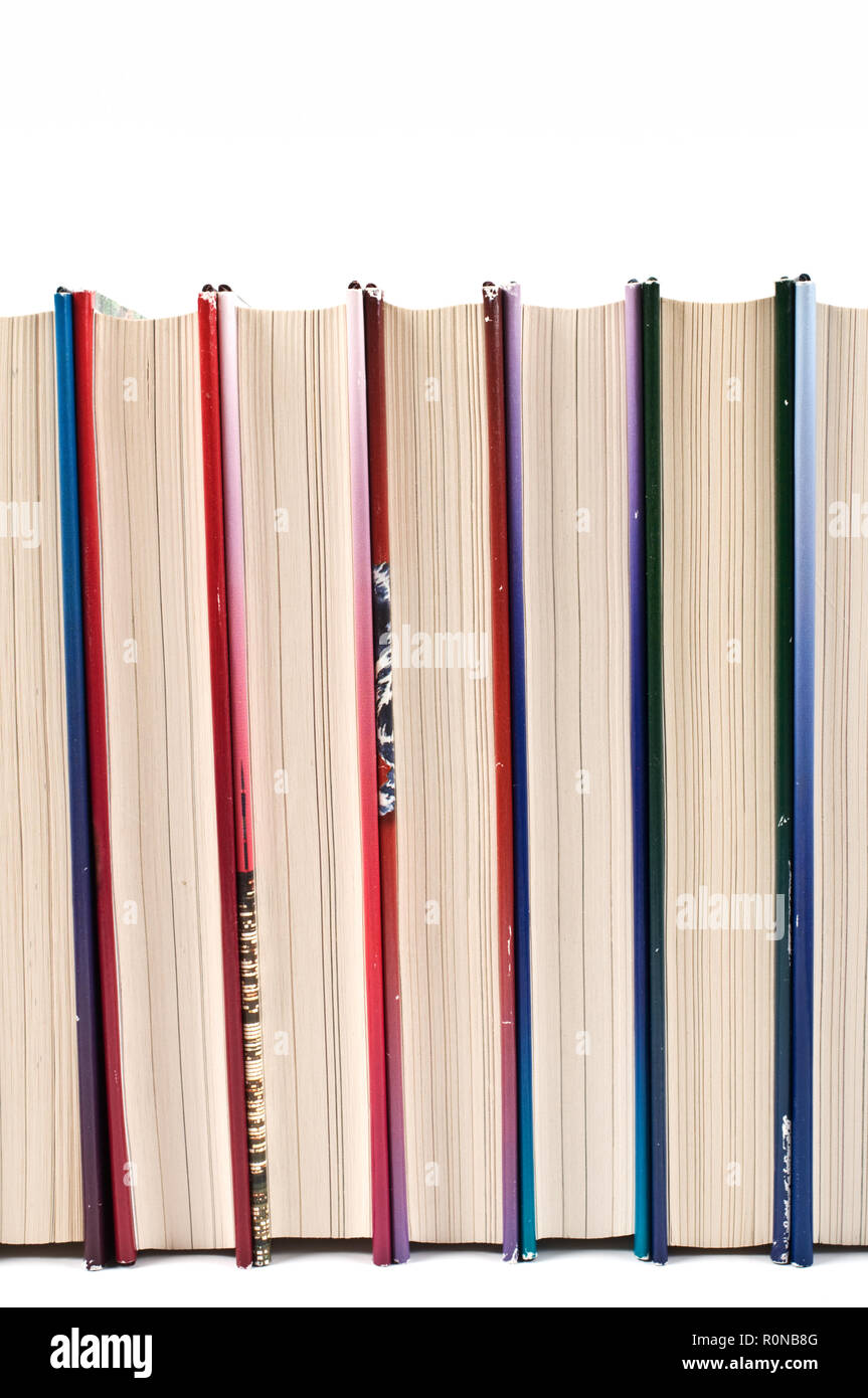 Books in a row on white background Stock Photo - Alamy