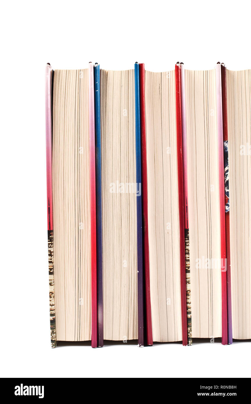 Books in a row on white background Stock Photo - Alamy
