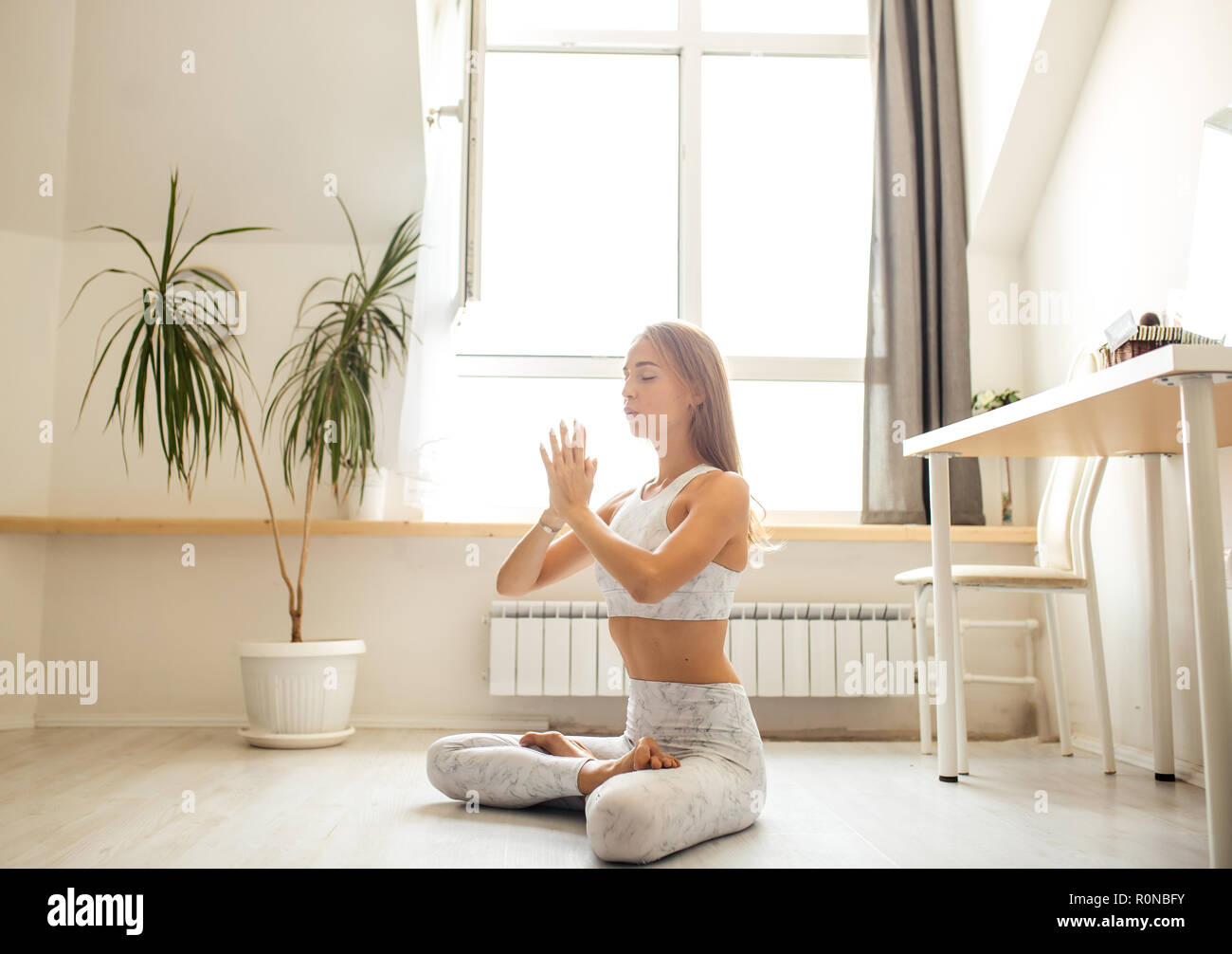 Woman meditating in the lotus position closeup Stock Photo - Alamy