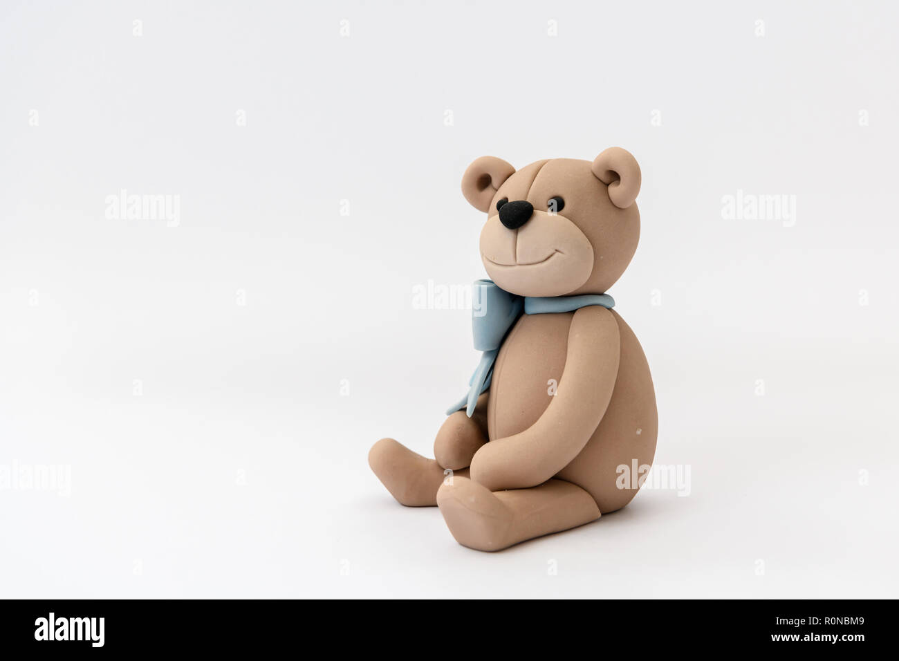 Cute model teddy bear made from sugar, isolated on a white background ...