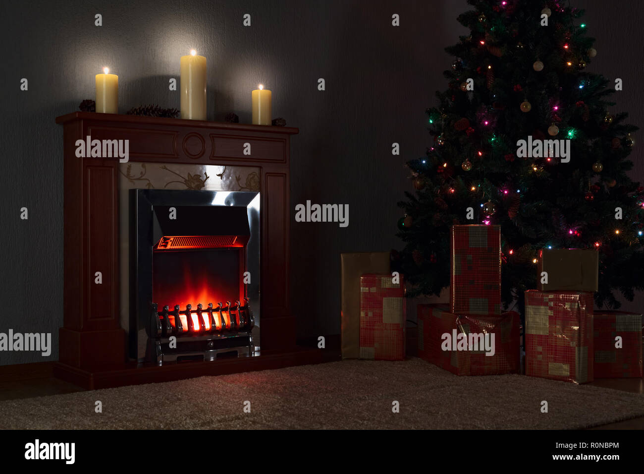 Christmas tree with gifts and fireplace in an empty room Stock Photo ...