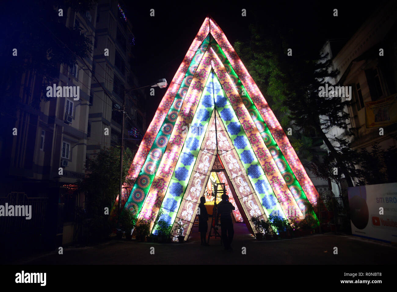 Pandal or temporary platform of Kali Puja illuminated with light during ...