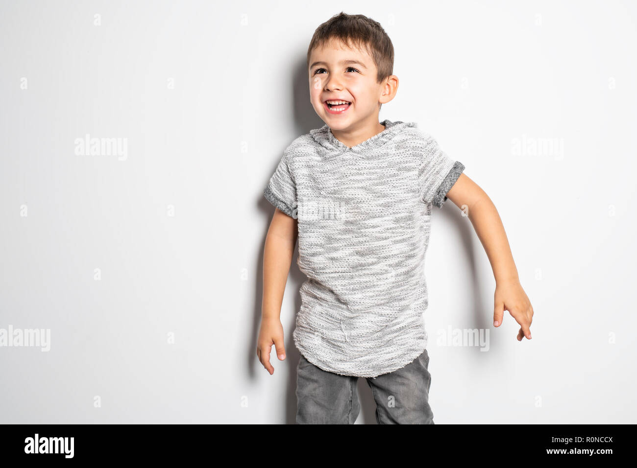 Boy having fun on studio white background Stock Photo - Alamy