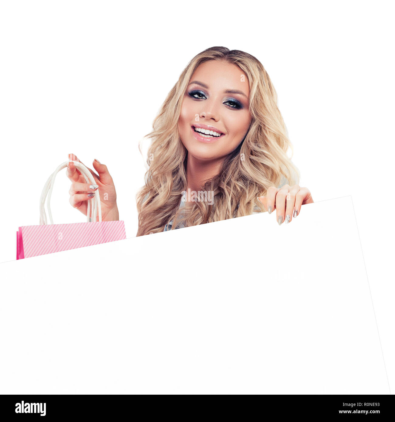 Young happy woman fashion model with shopping bags and white empty ...