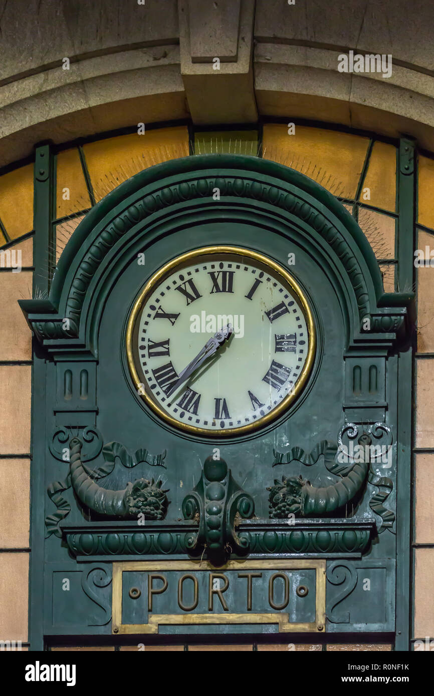 View of classic retro wall clock at the train station of St. Bento in ...