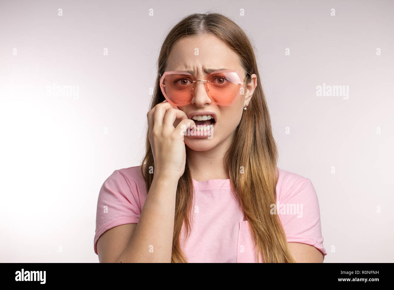 Embarrassed shy nervous young woman hi-res stock photography and images ...