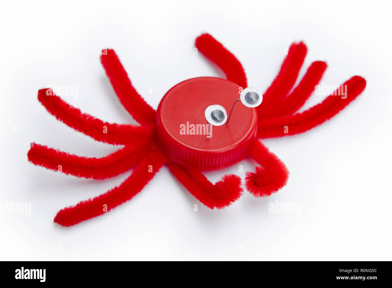 Plastic bottle cap recycled in a crab figure. Reuse garbabe. Toy Stock ...