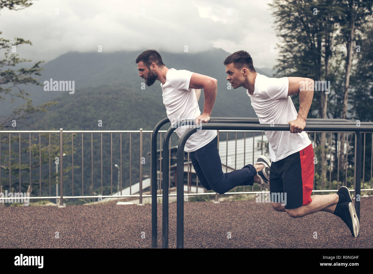 Gymnast on parallel bars outside hi-res stock photography and images ...