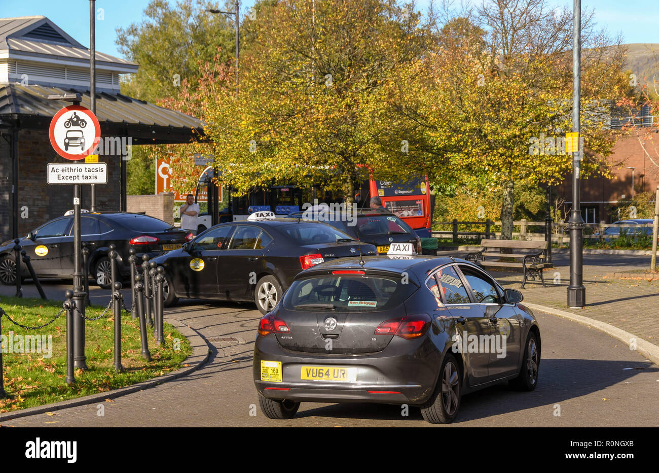ABERDARE, WALES - OCTOBER 2018: Taxis queuing at the bus station in ...
