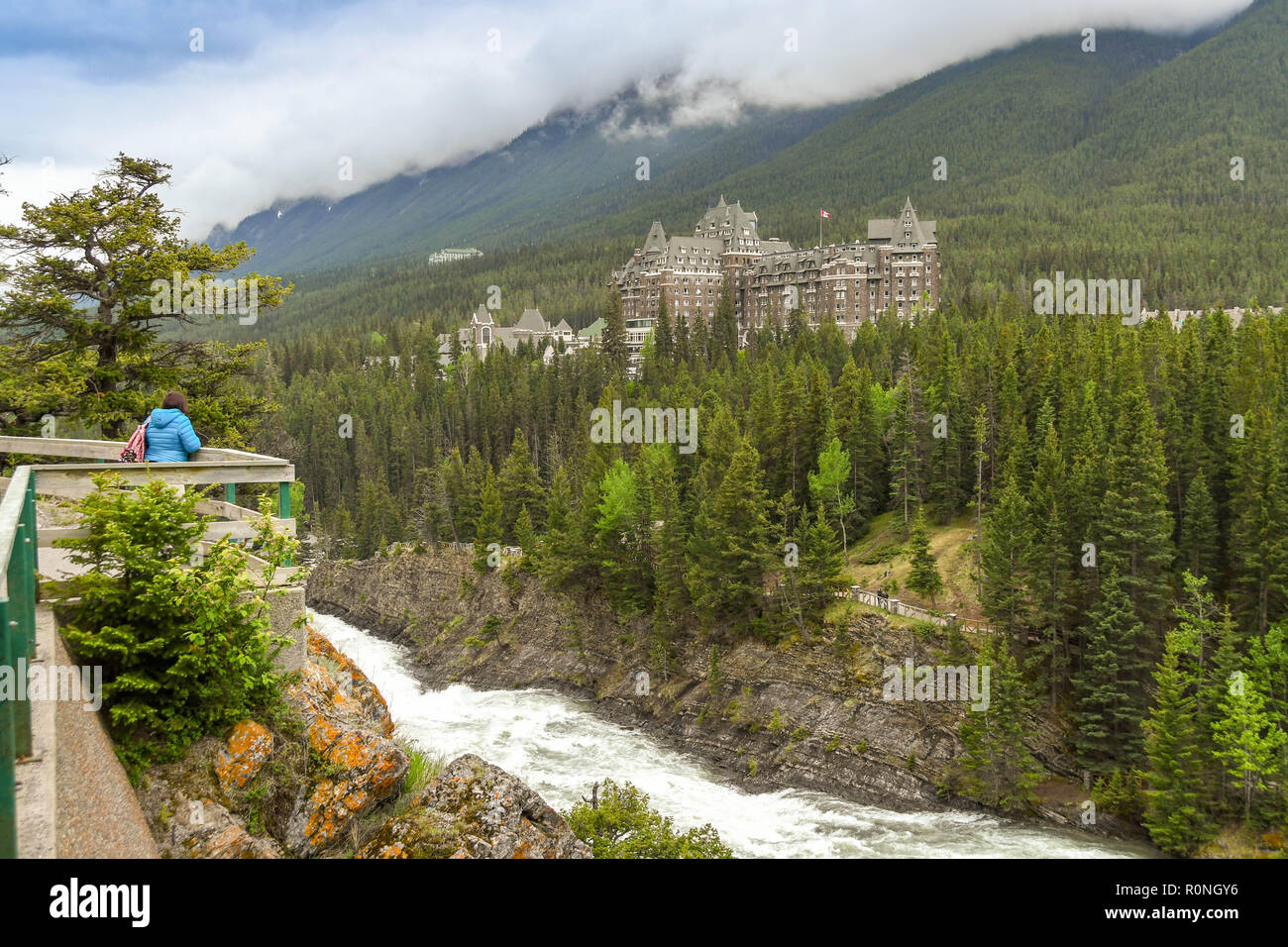 BANFF, AB, CANADA - JUNE 2018: Person on lookout point viewing the Bow ...