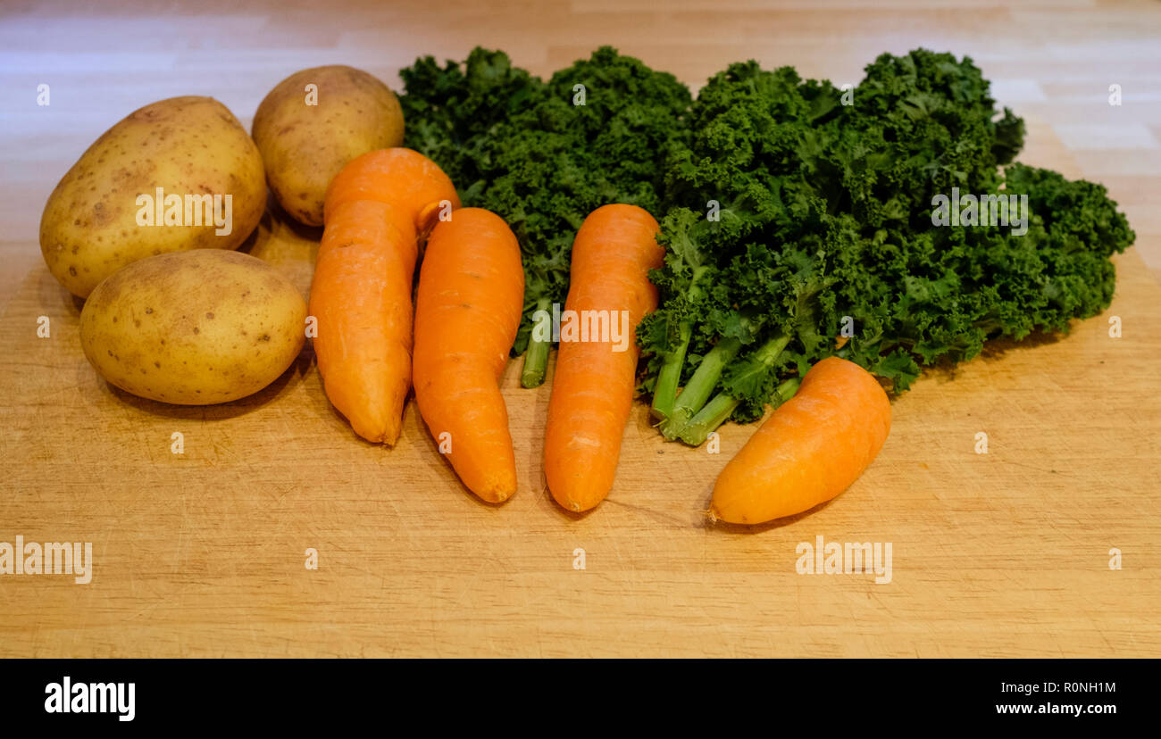 Fresh vegetables on a chopping board ready to be prepared for a healthy ...
