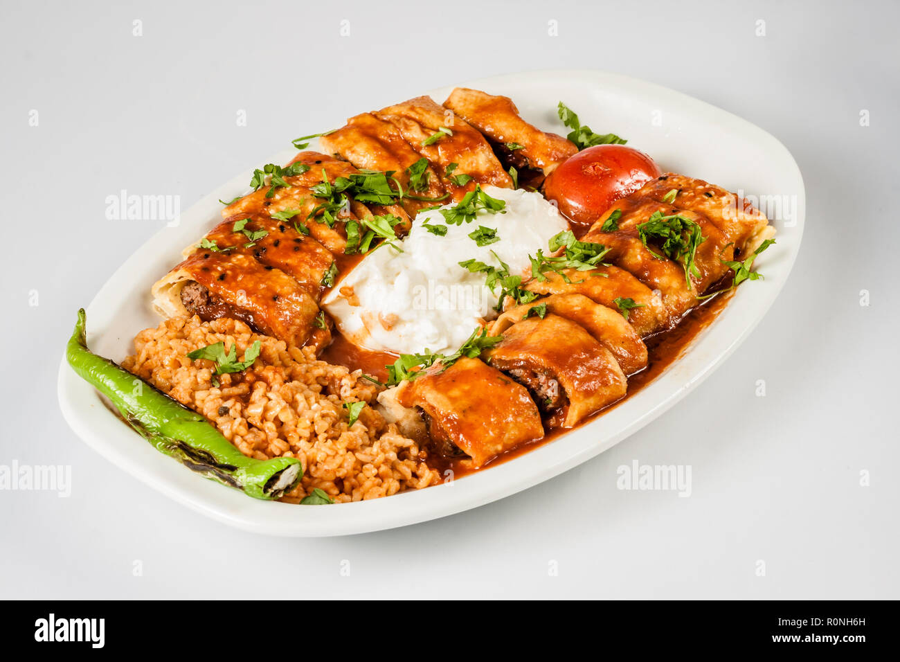 Turkish Beyti Kebab served with bulgur pilaf and yoghurt Stock Photo ...