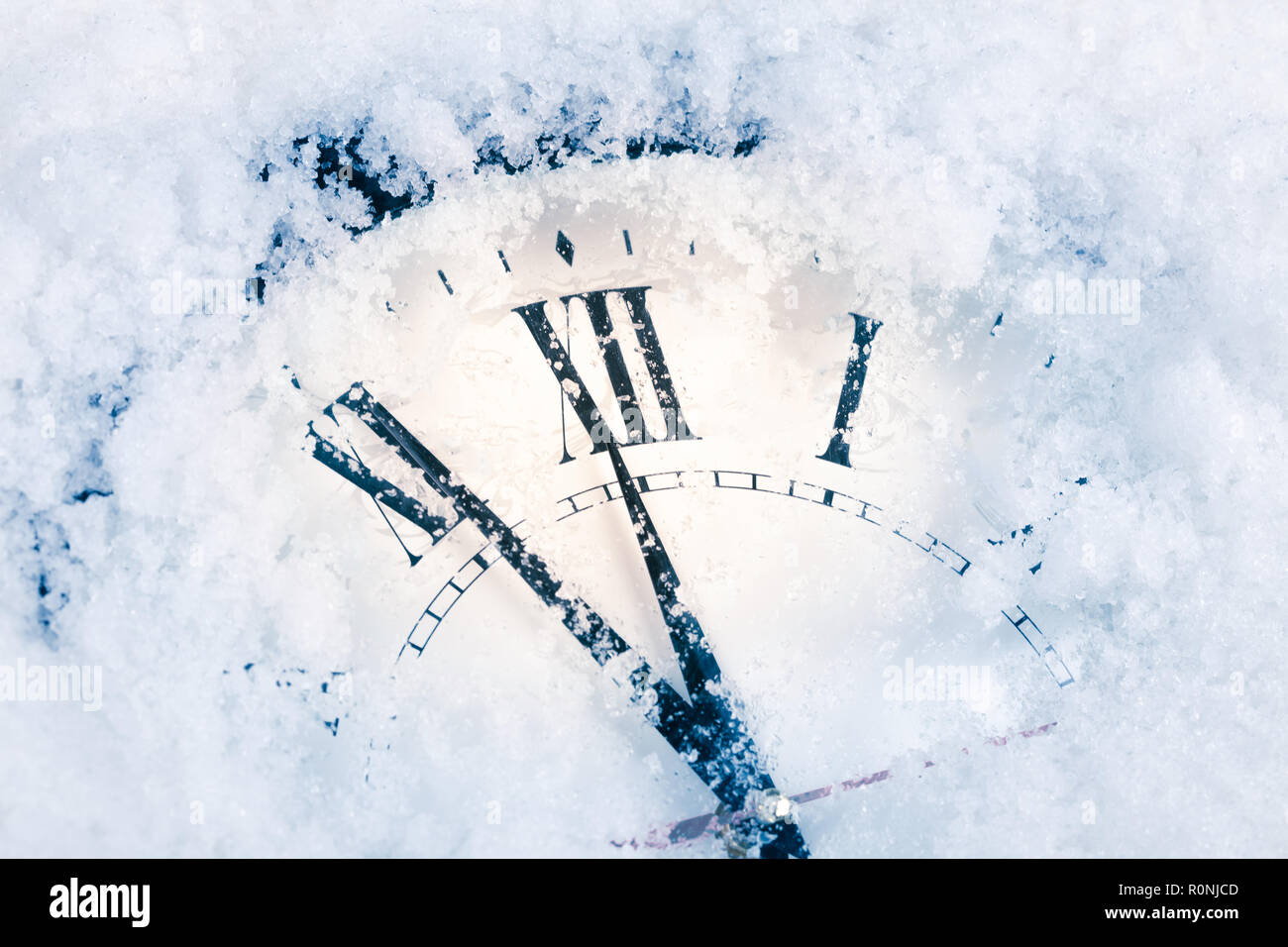 New Year's clock in the snow. Christmas card Stock Photo - Alamy