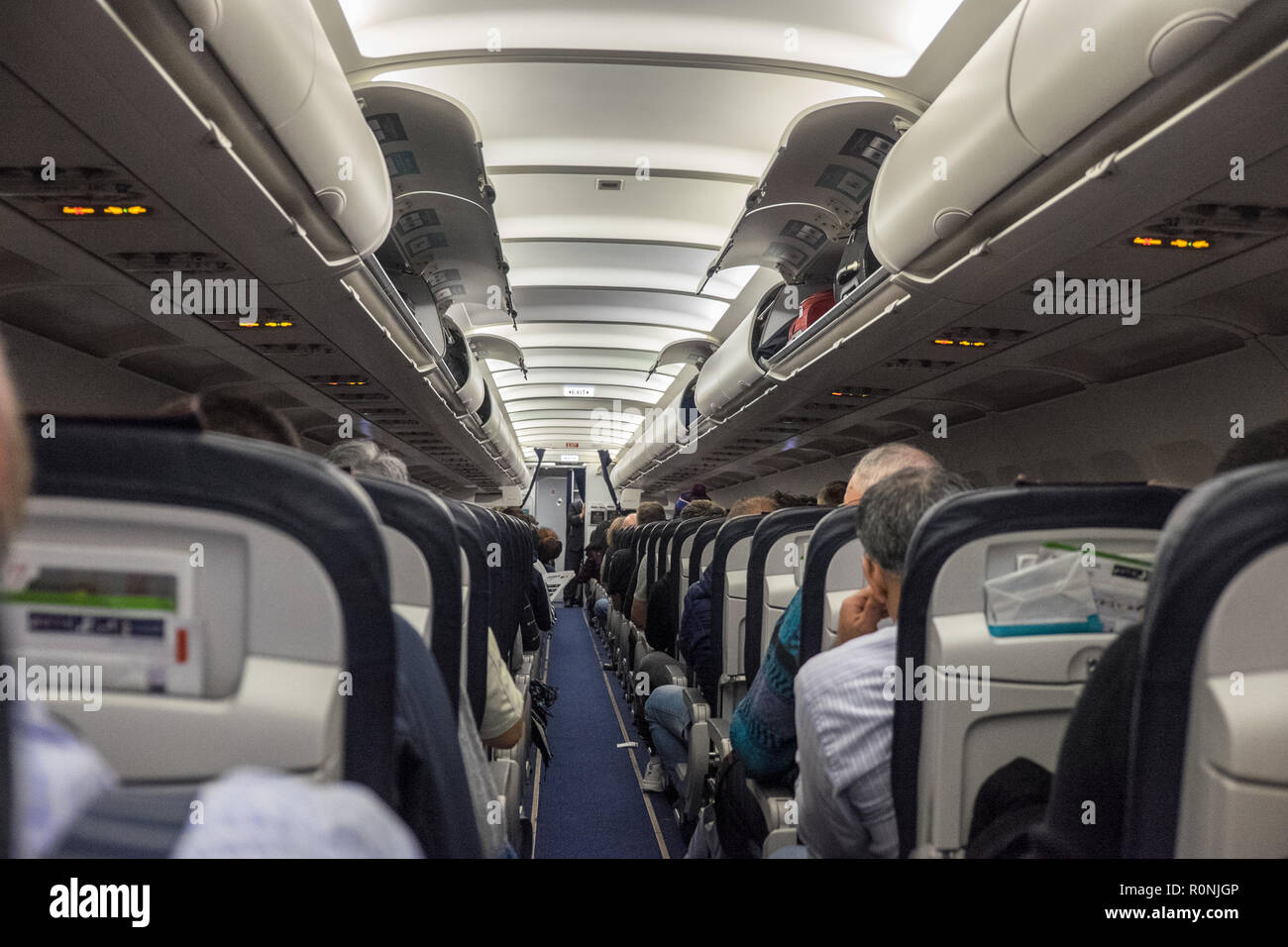 Airplane overhead bins hi-res stock photography and images - Alamy