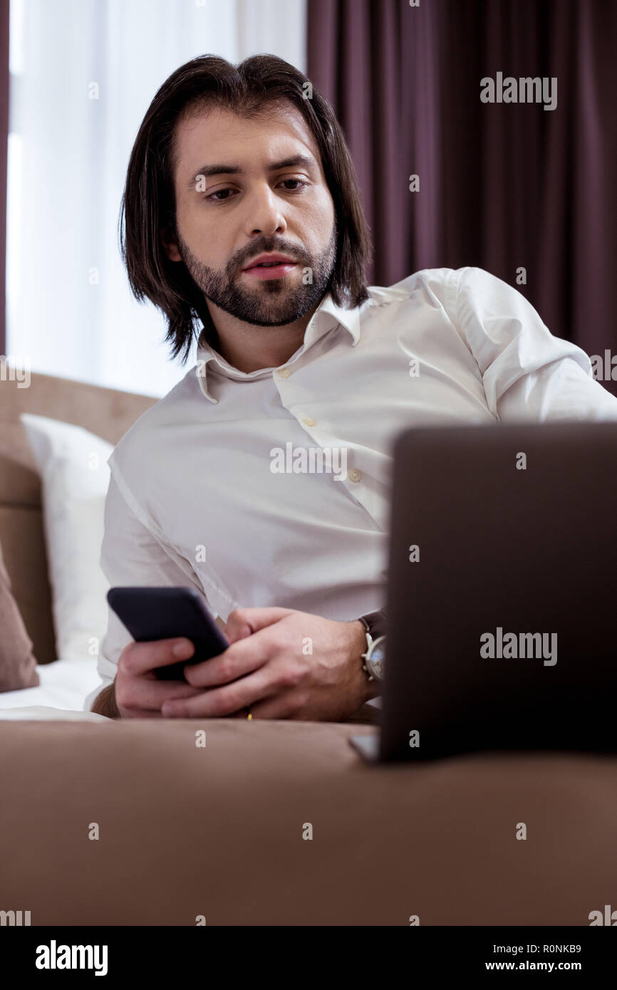 Smart professional manager doing his work remotely Stock Photo - Alamy