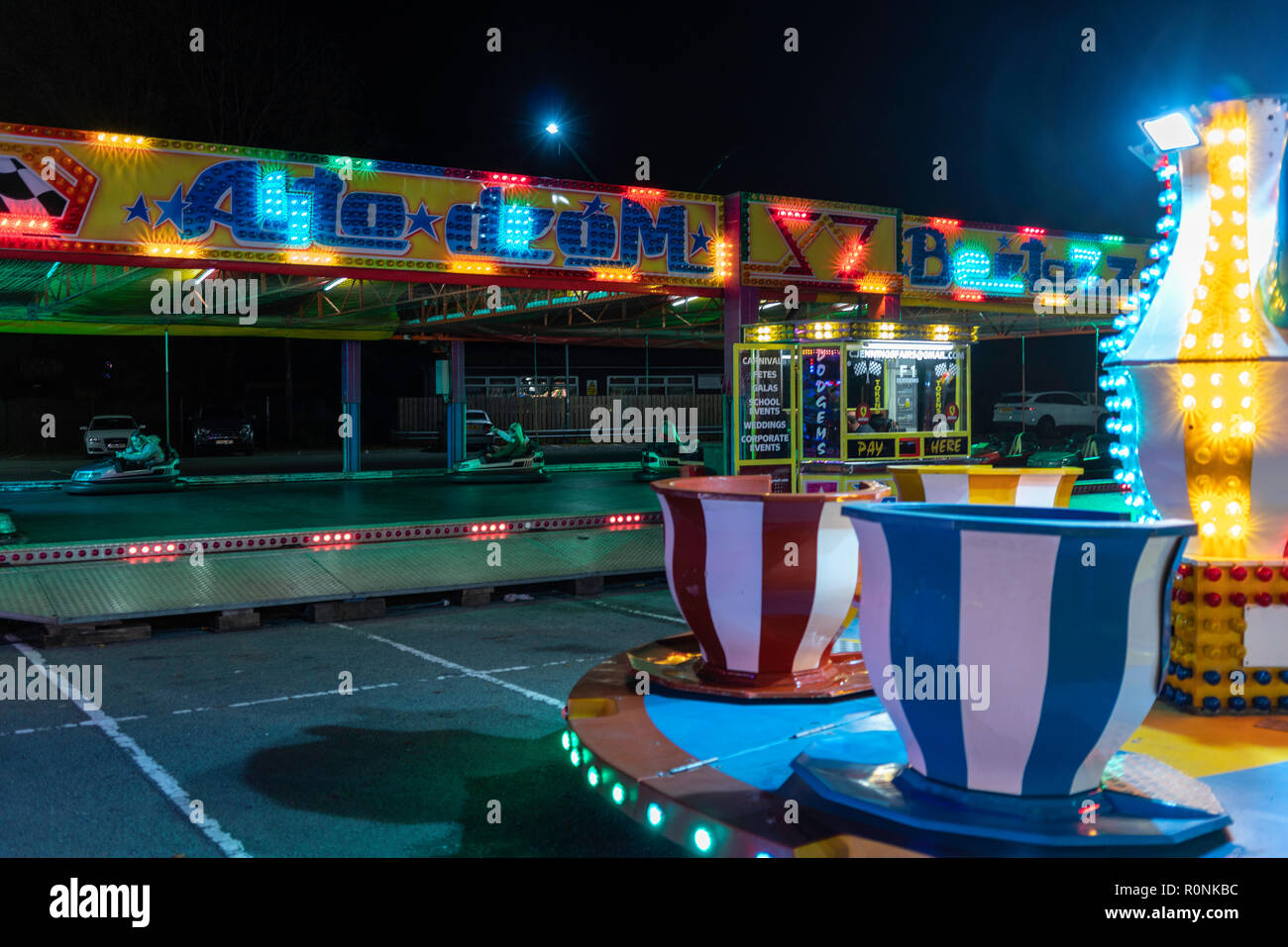 A neon-lit attraction in a fun fair in Machynlleth, Wales, UK Stock ...