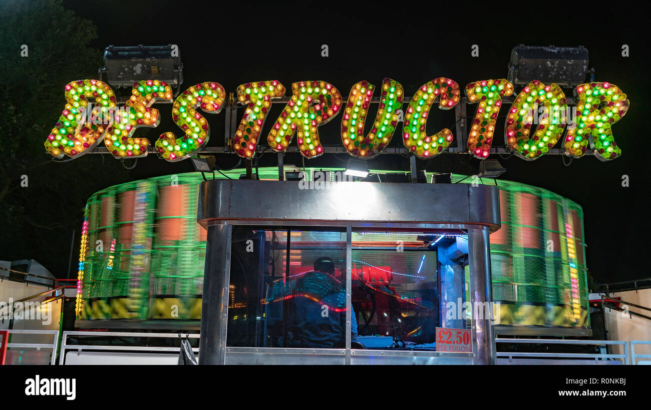 A neon-lit attraction in a fun fair in Machynlleth, Wales, UK Stock ...