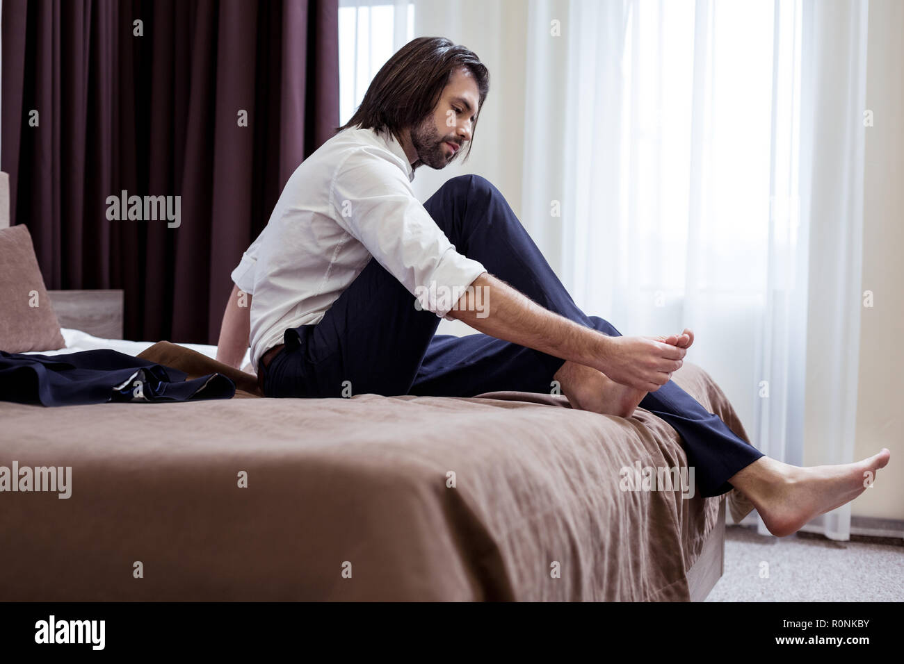 Looking at his feet hi-res stock photography and images - Alamy