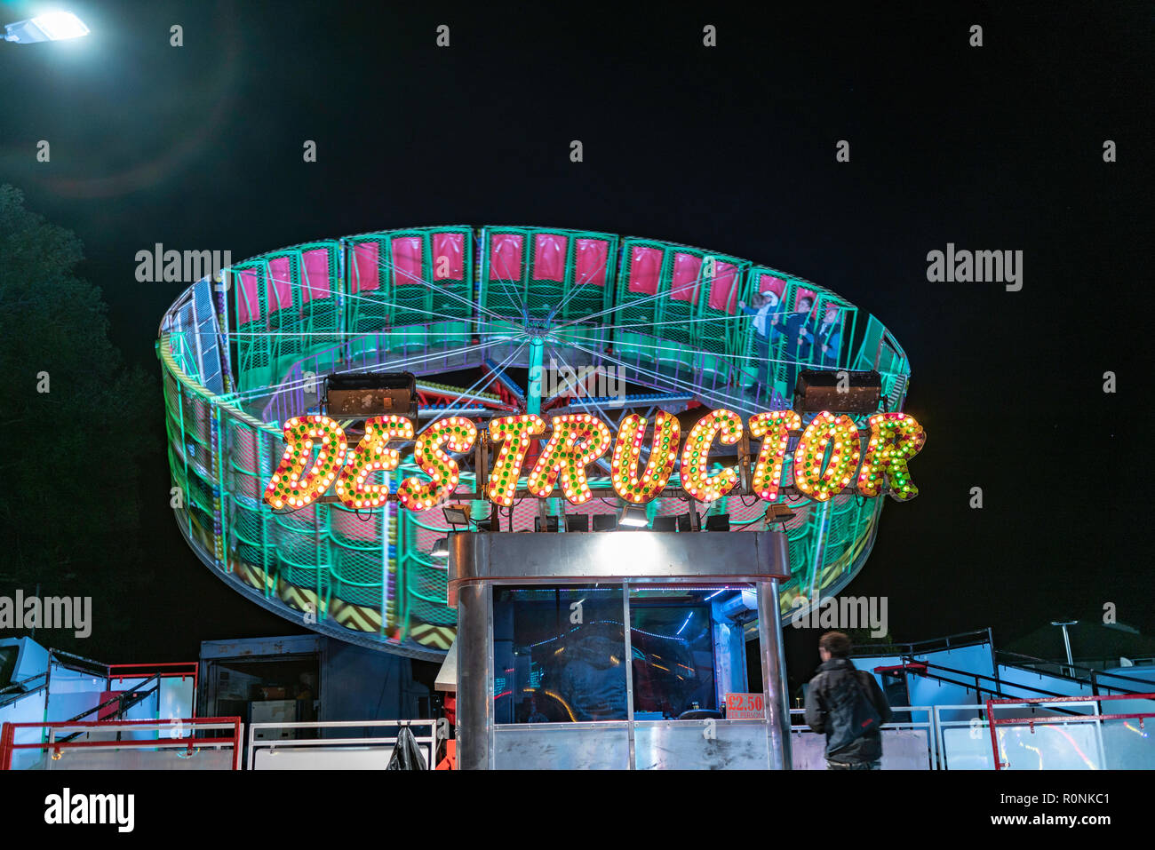 A neon-lit attraction in a fun fair in Machynlleth, Wales, UK Stock ...