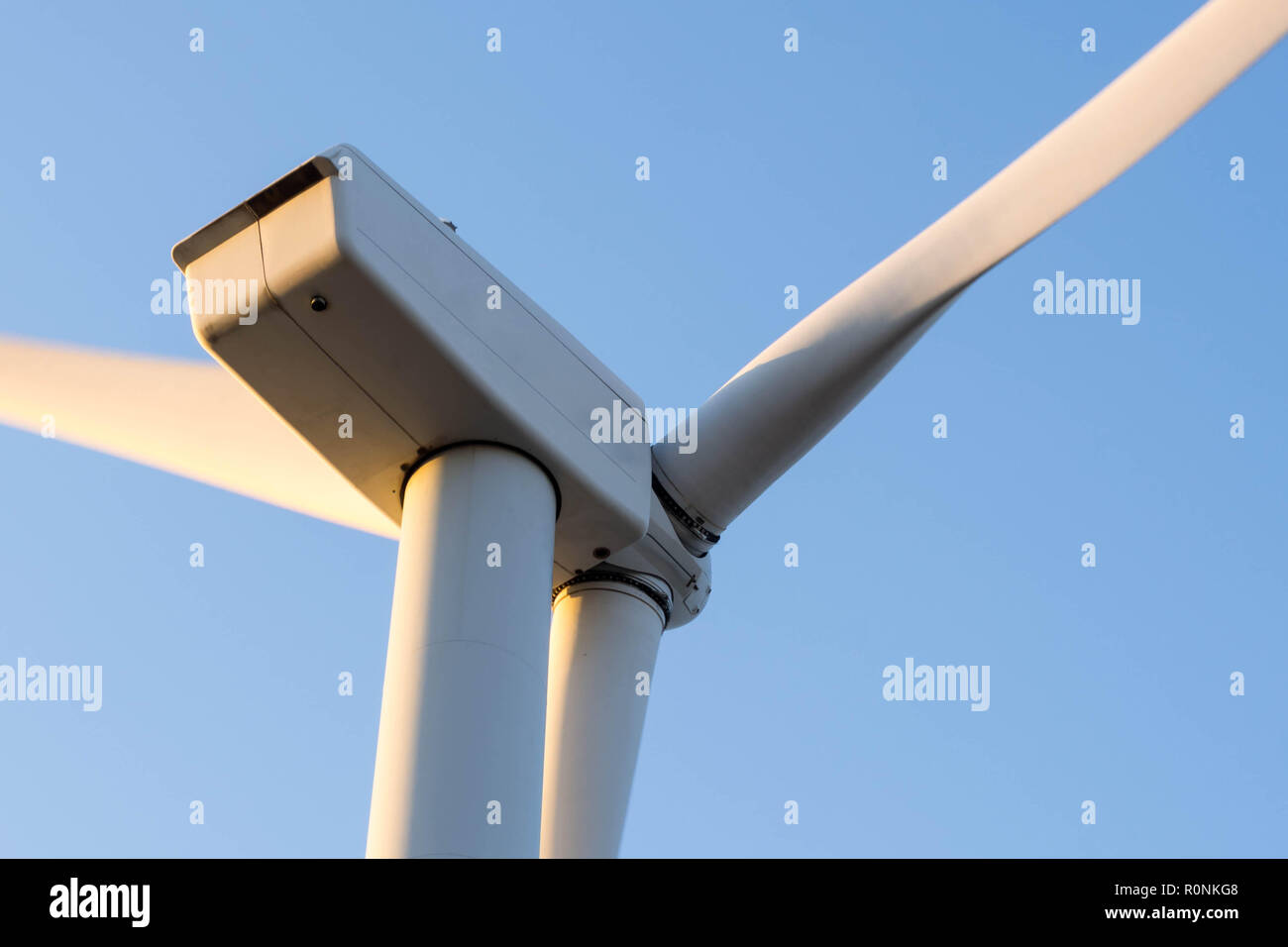 Wind power generator with blue sky background Stock Photo - Alamy