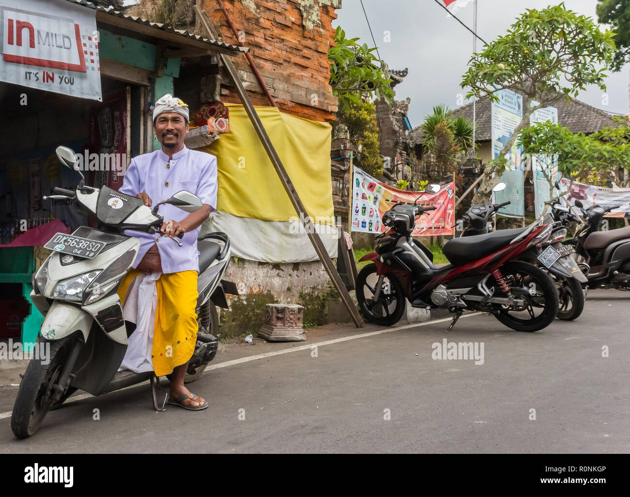 Indonesian man and his motorcycle on Bali, Indonesia Stock Photo - Alamy